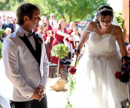 Woman with a spinal cord injury walks down the aisle on her wedding day