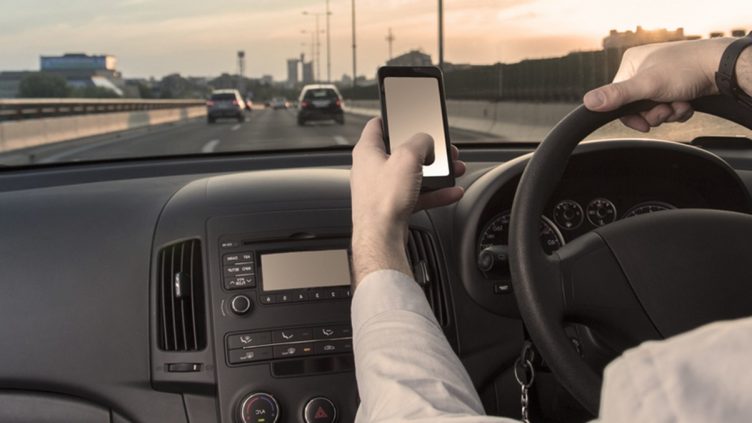 Proposals to ban drivers from using hand-held mobile while driving